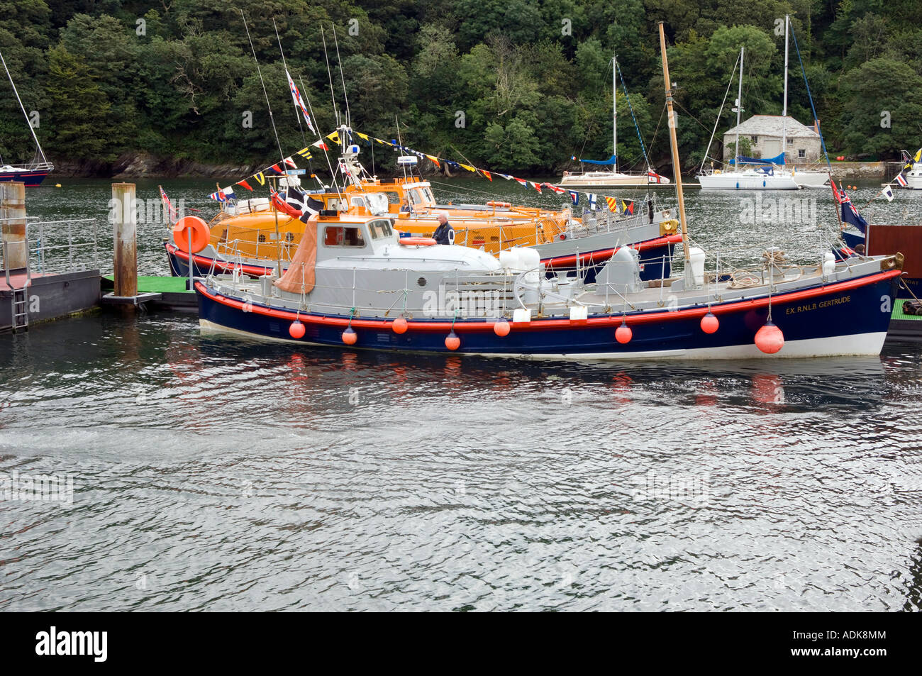 An old fashioned and modern lifeboat moored in Fowey Cornwall Stock ...