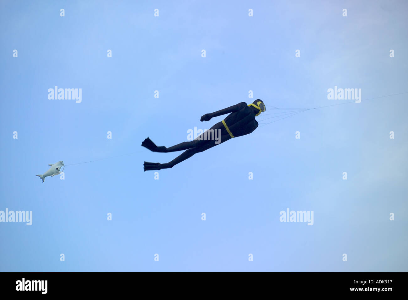 Flying kite of a diver figure and a fish Stock Photo - Alamy
