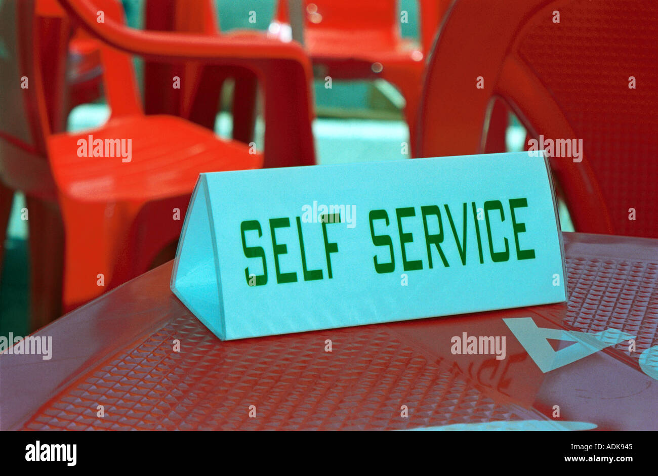 self service sign on plastic table Stock Photo - Alamy