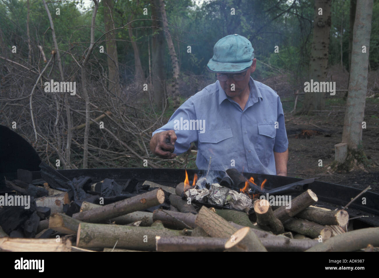 Forestry Lighting fire in charcoal burning kiln S Stock Photo - Alamy