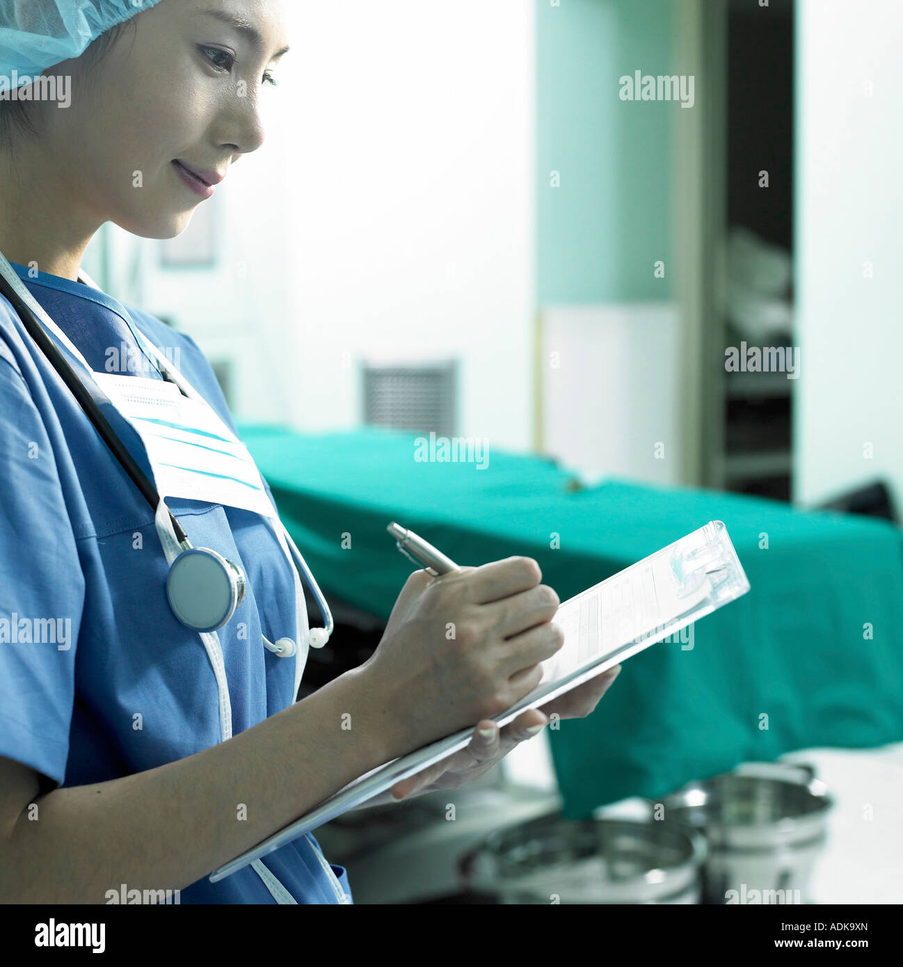medicine a doctor writing a medical chart Stock Photo - Alamy