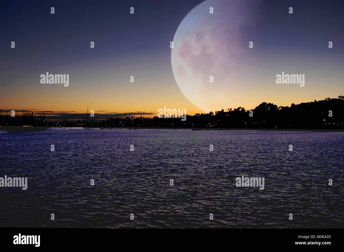 Full moon magnified over Santa Barbas California harbor Stock Photo - Alamy