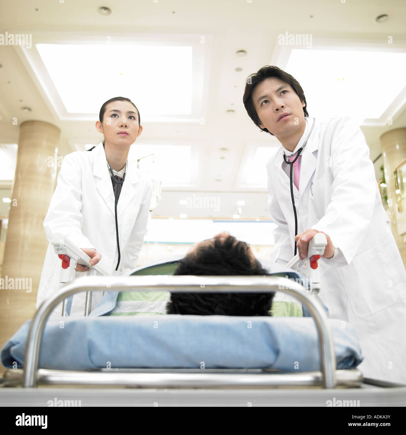 medicine a doctor moving an emergent patient Stock Photo - Alamy