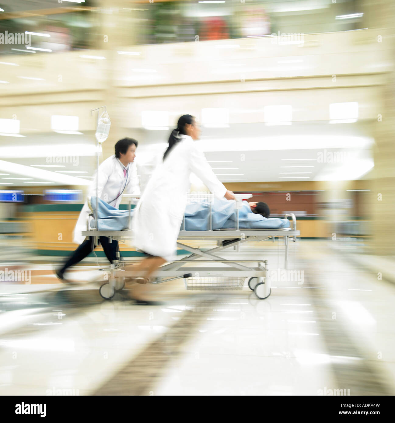 medicine a doctor moving an emergent patient Stock Photo - Alamy