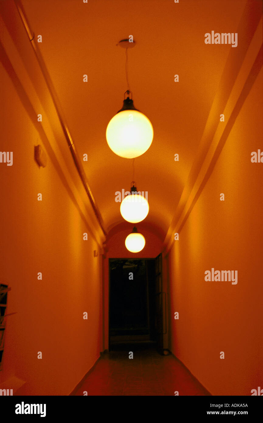 corridor with lit round ceiling lamps Stock Photo - Alamy
