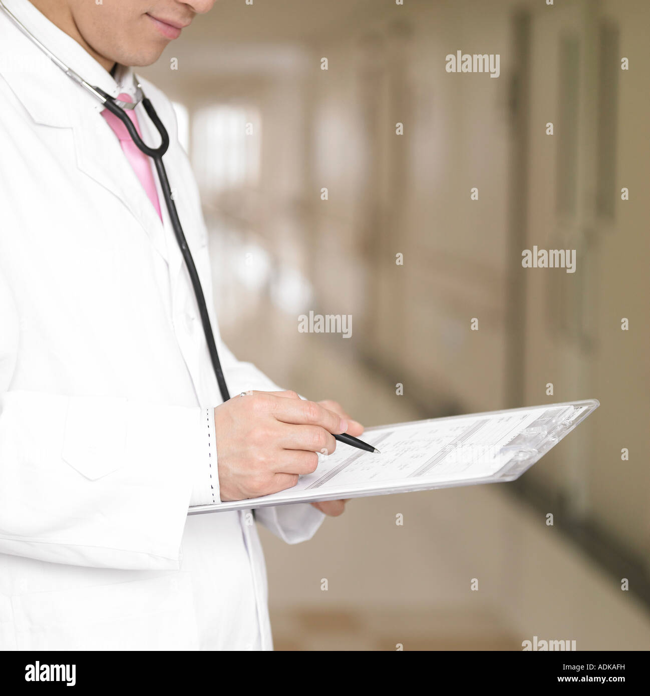 medicine a doctor writing a medical chart Stock Photo - Alamy