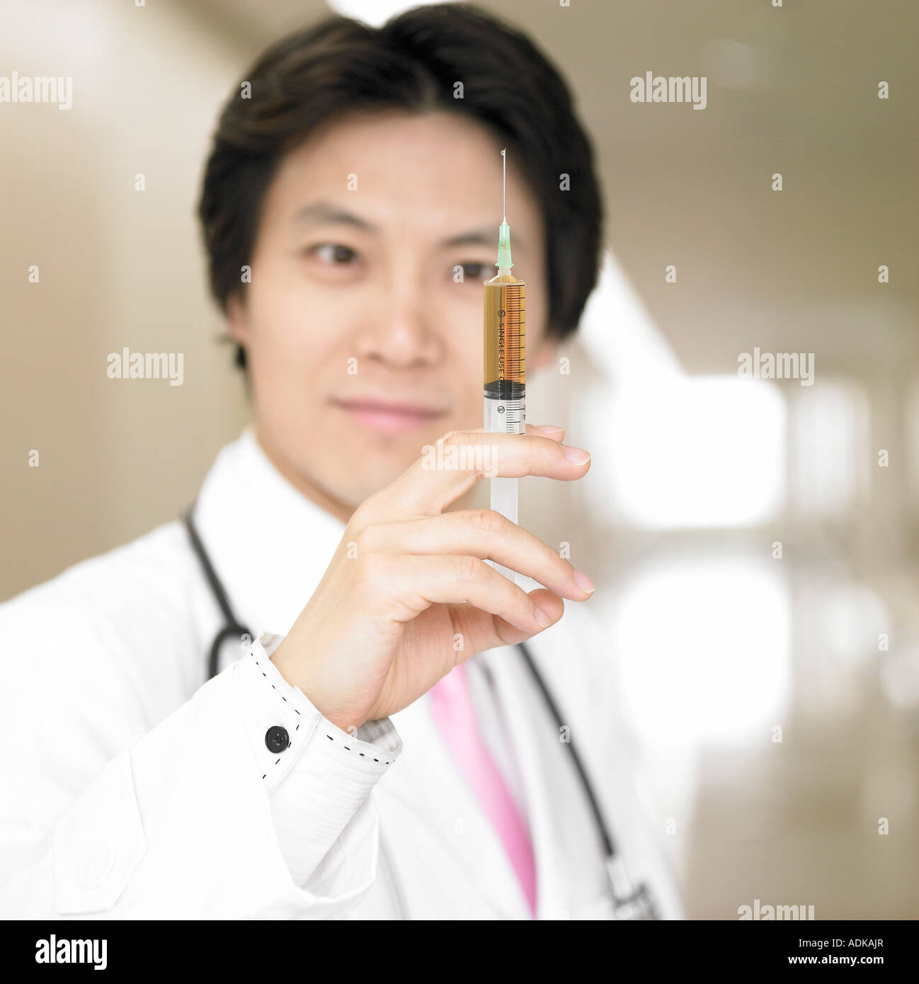 medicine a doctor holding an injector Stock Photo - Alamy