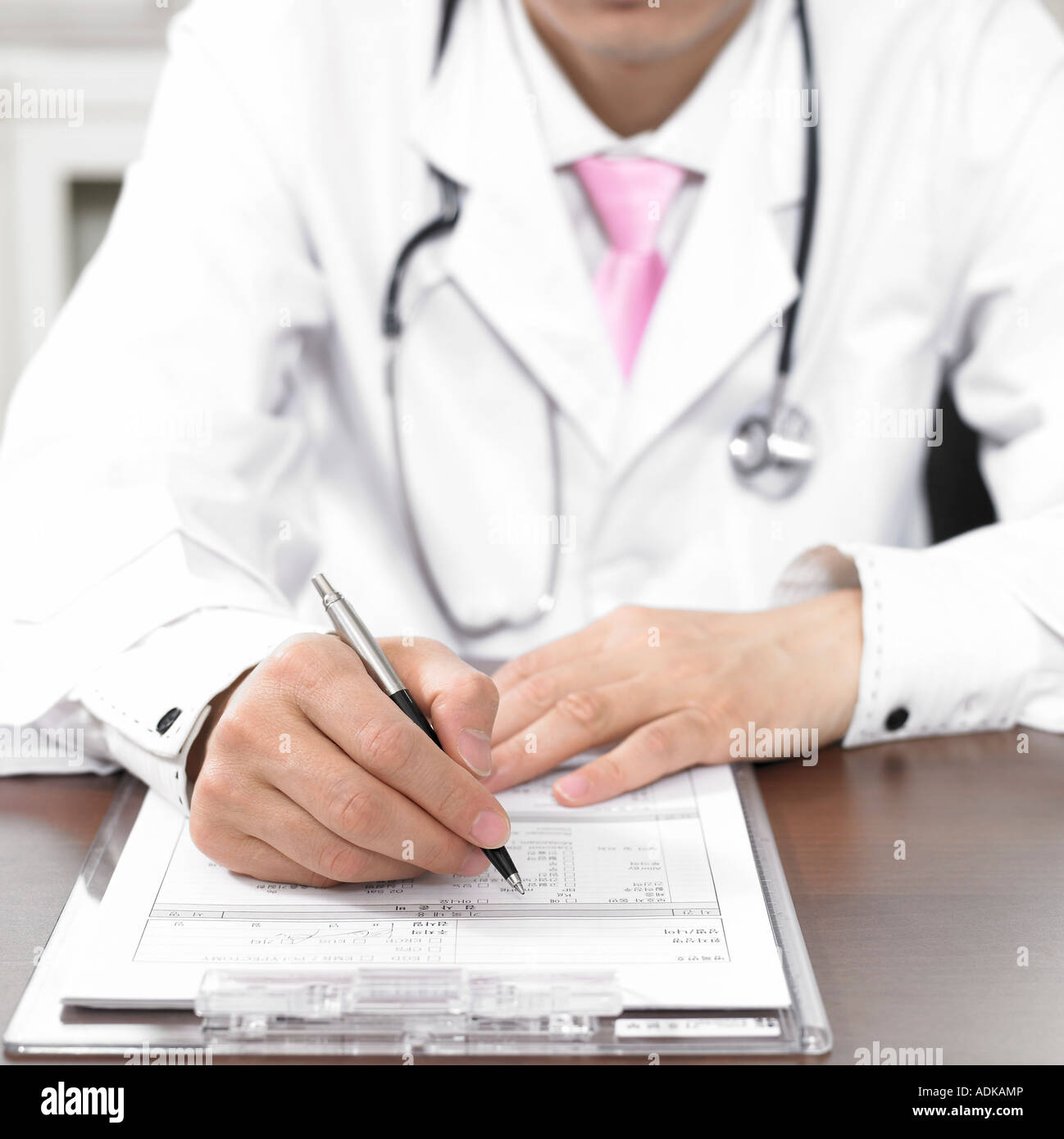 medicine a doctor writing a medical chart Stock Photo - Alamy