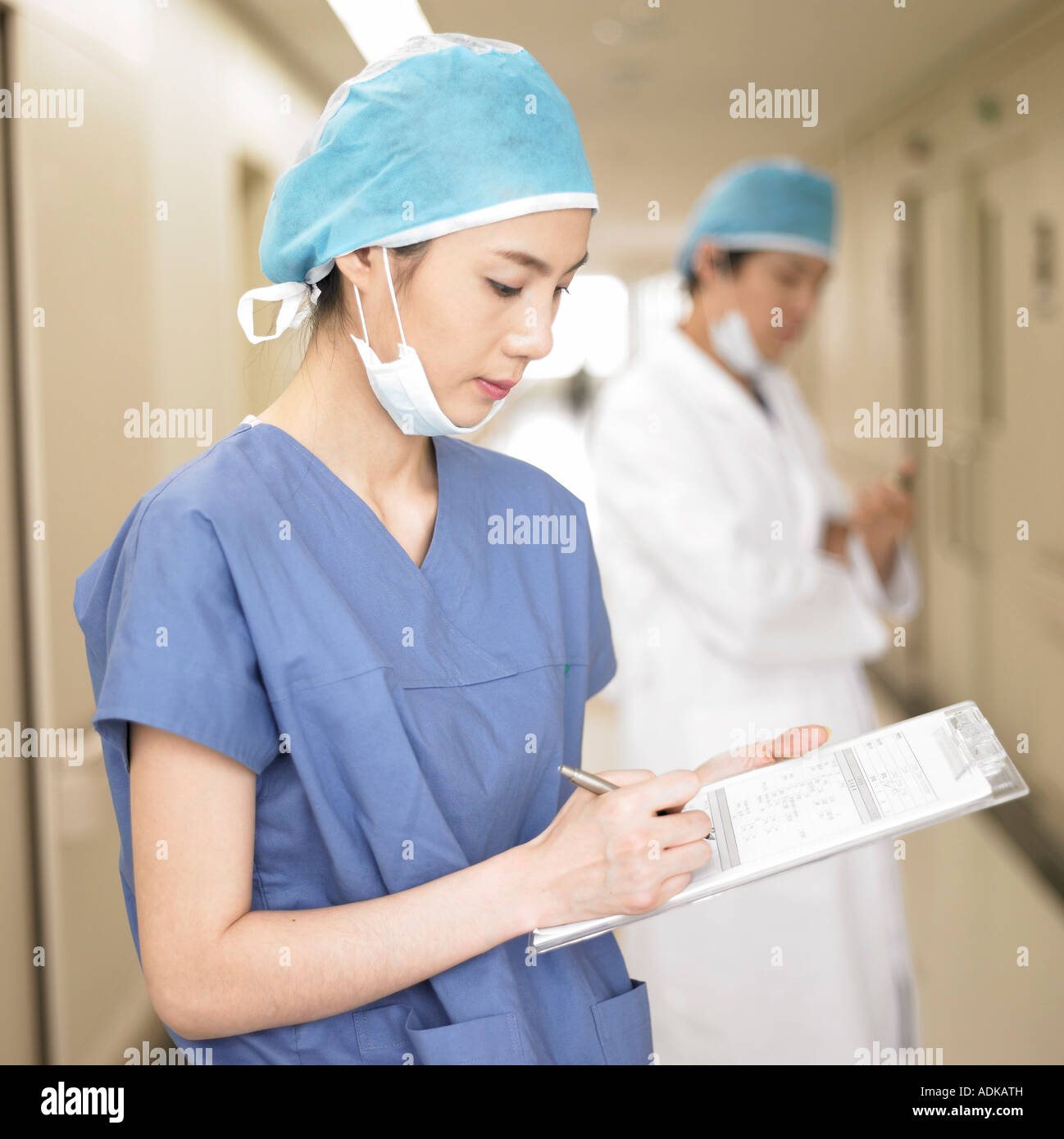 medicine a doctor writing a medical chart Stock Photo - Alamy