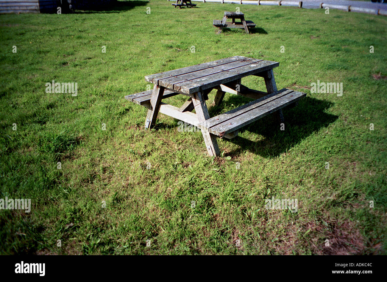 decayed picnic bench and table on grass Stock Photo - Alamy