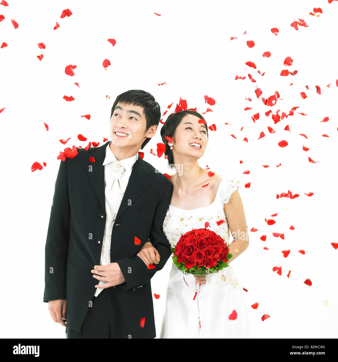 a bridegroom and a bride flying flowers Stock Photo - Alamy