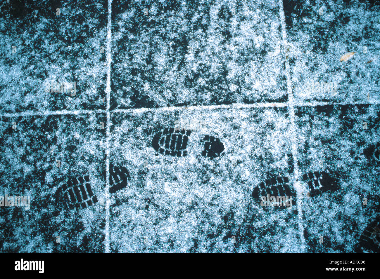 footsteps in snow on pavement Stock Photo - Alamy