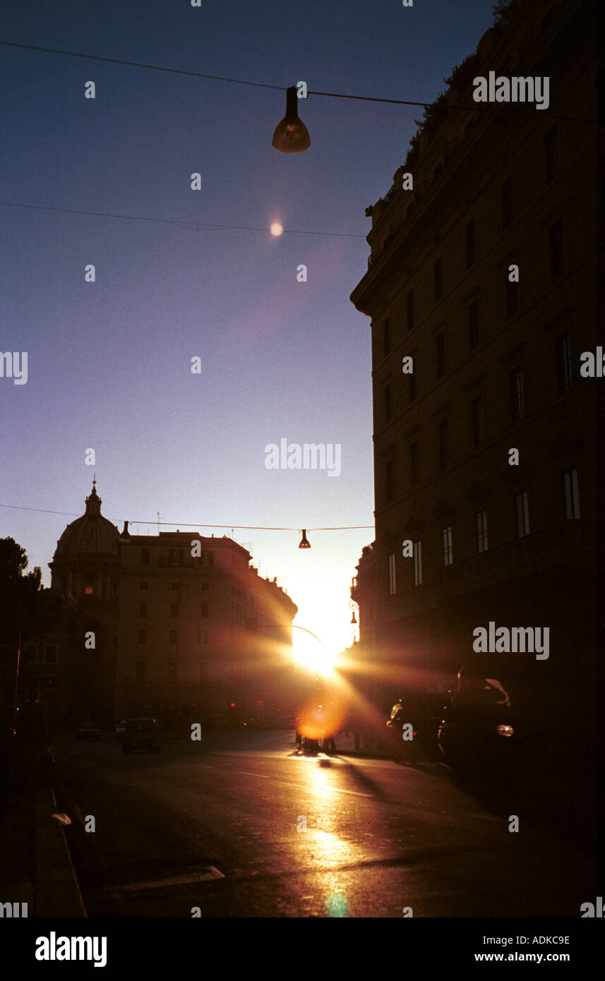 sun breaking through city skyline Stock Photo - Alamy
