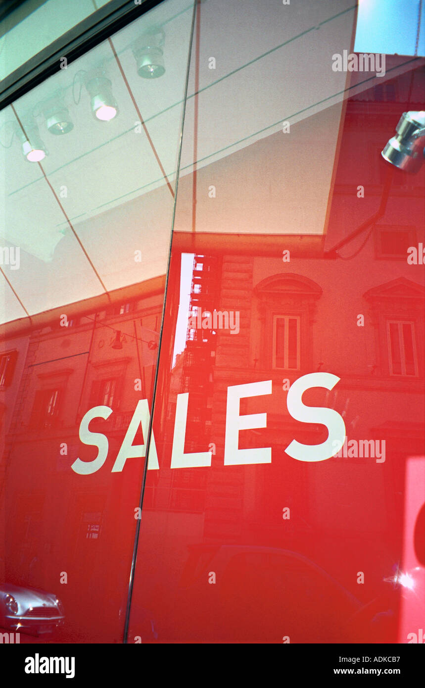 sales sign in shop window Stock Photo - Alamy