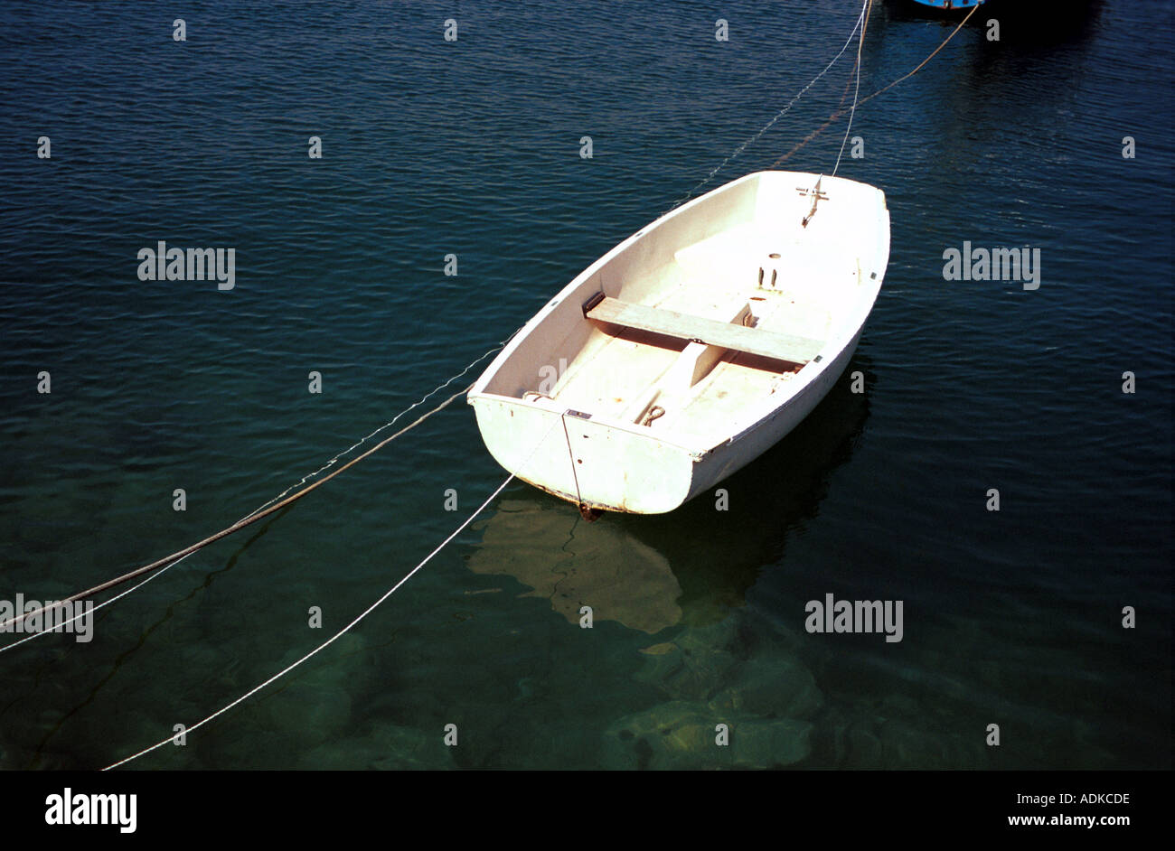 moored white rowing boat Stock Photo - Alamy