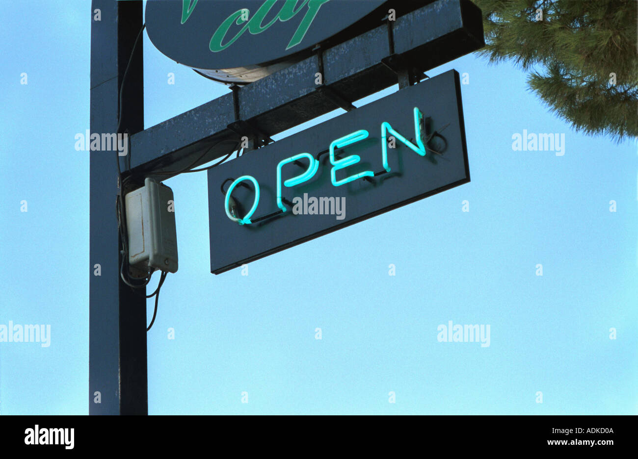 green neon open sign on pole Stock Photo - Alamy