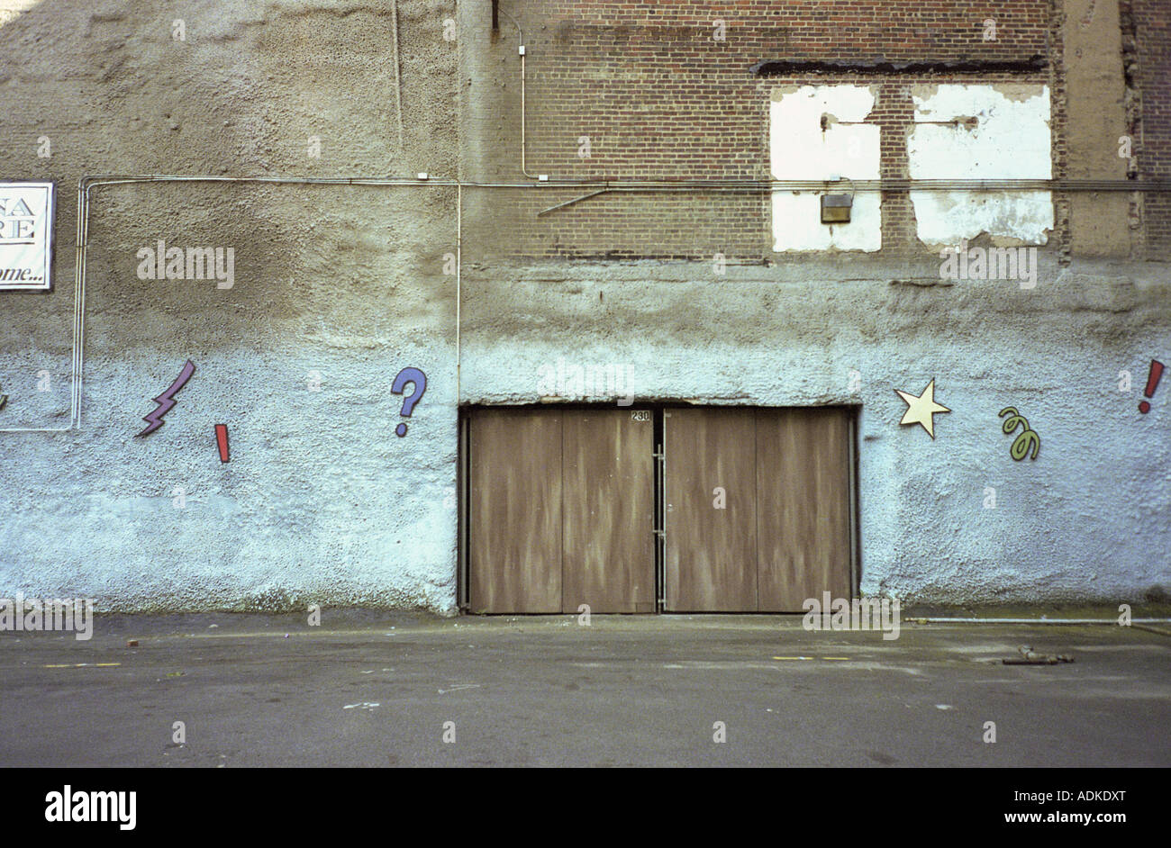 square wooden doors in alleyway Stock Photo - Alamy