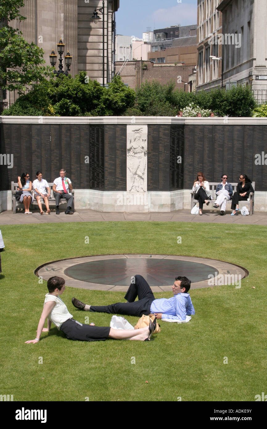 Office workers relax in Trinity Square Gardens in the City of London ...