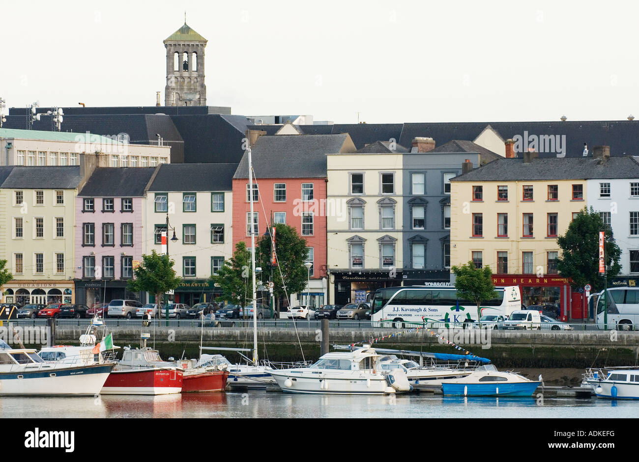 Old quayside buildings line the south bank of the River Suir in the ...