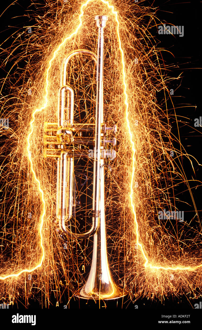 Trumpet outlined with sparks Stock Photo - Alamy