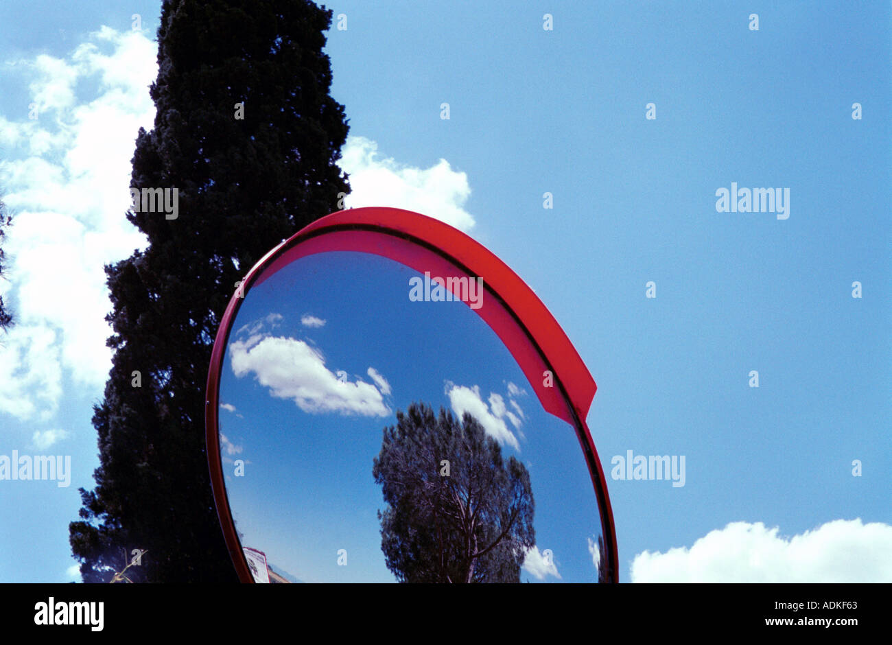 road safety circular mirror and countryside Stock Photo - Alamy