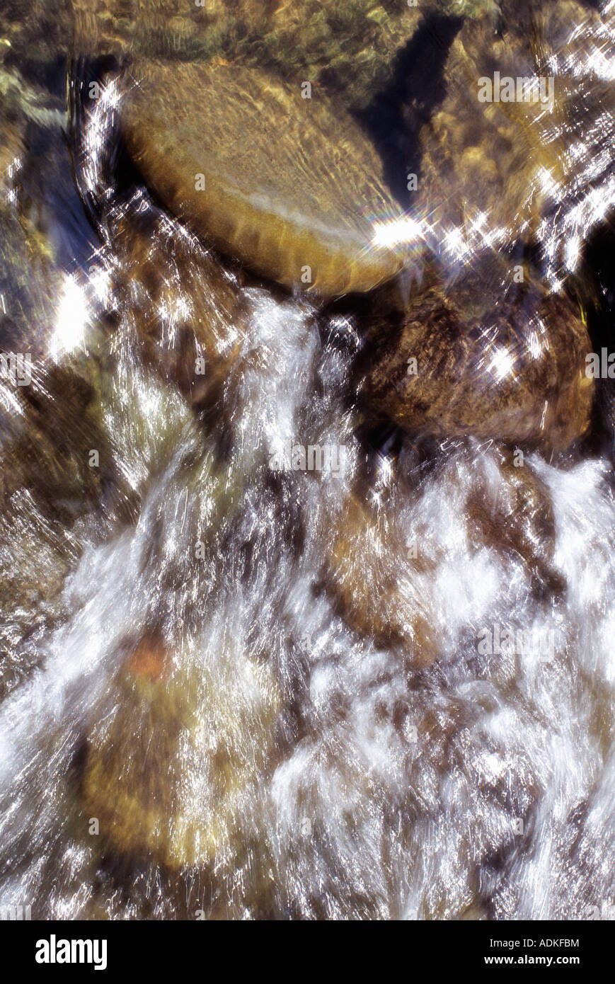 Close-up of water rushing over rocks in stream bed Stock Photo - Alamy
