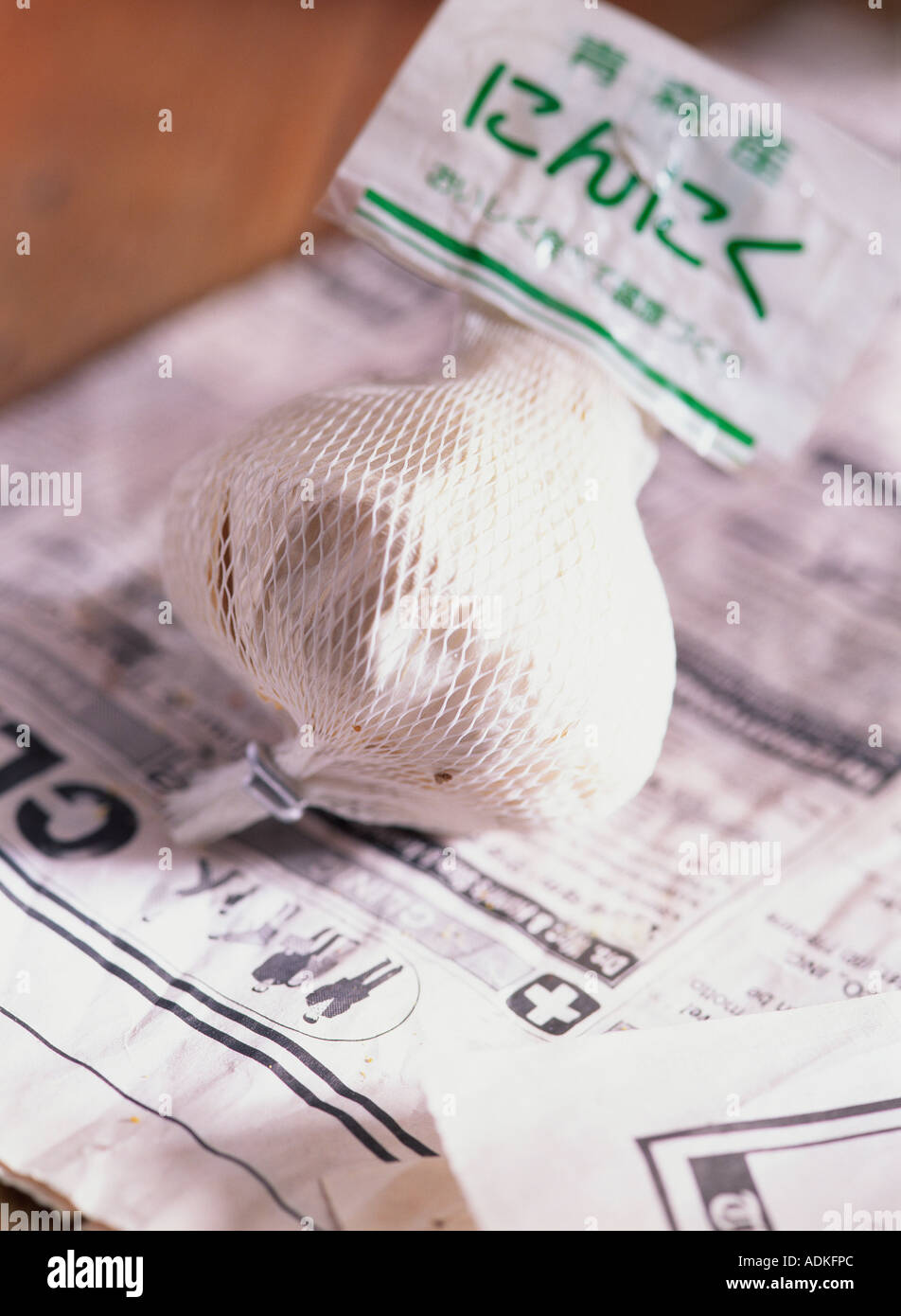 food ingredients garlic in a net Stock Photo - Alamy