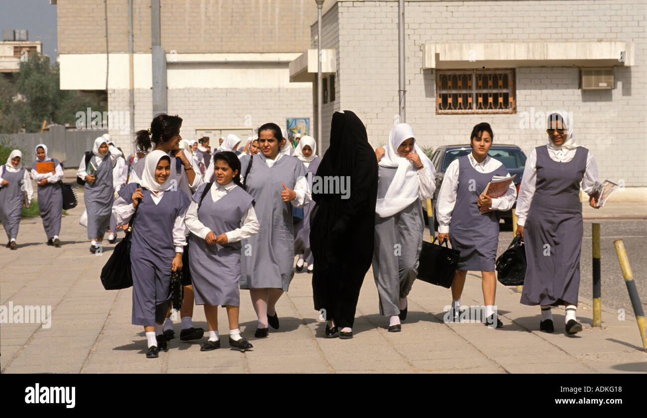 Muslim college girls walking with teachers in educational precinct ...
