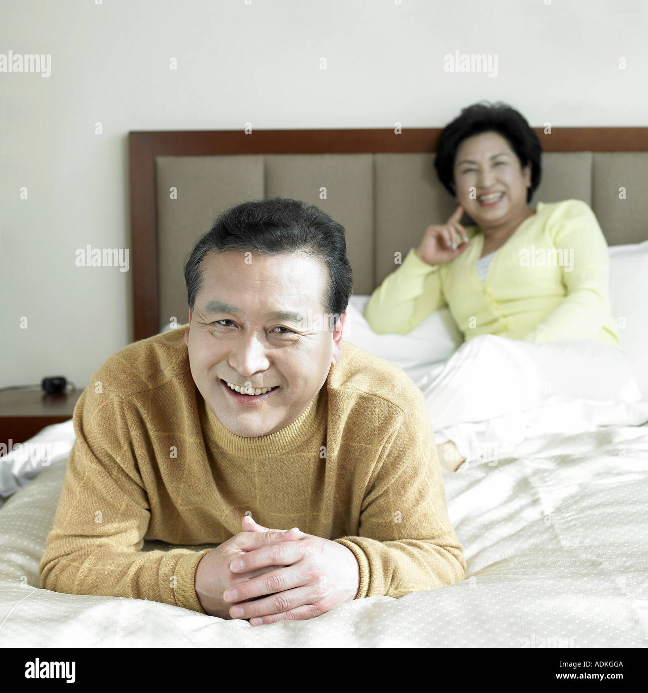 an old couple on a bed Stock Photo - Alamy