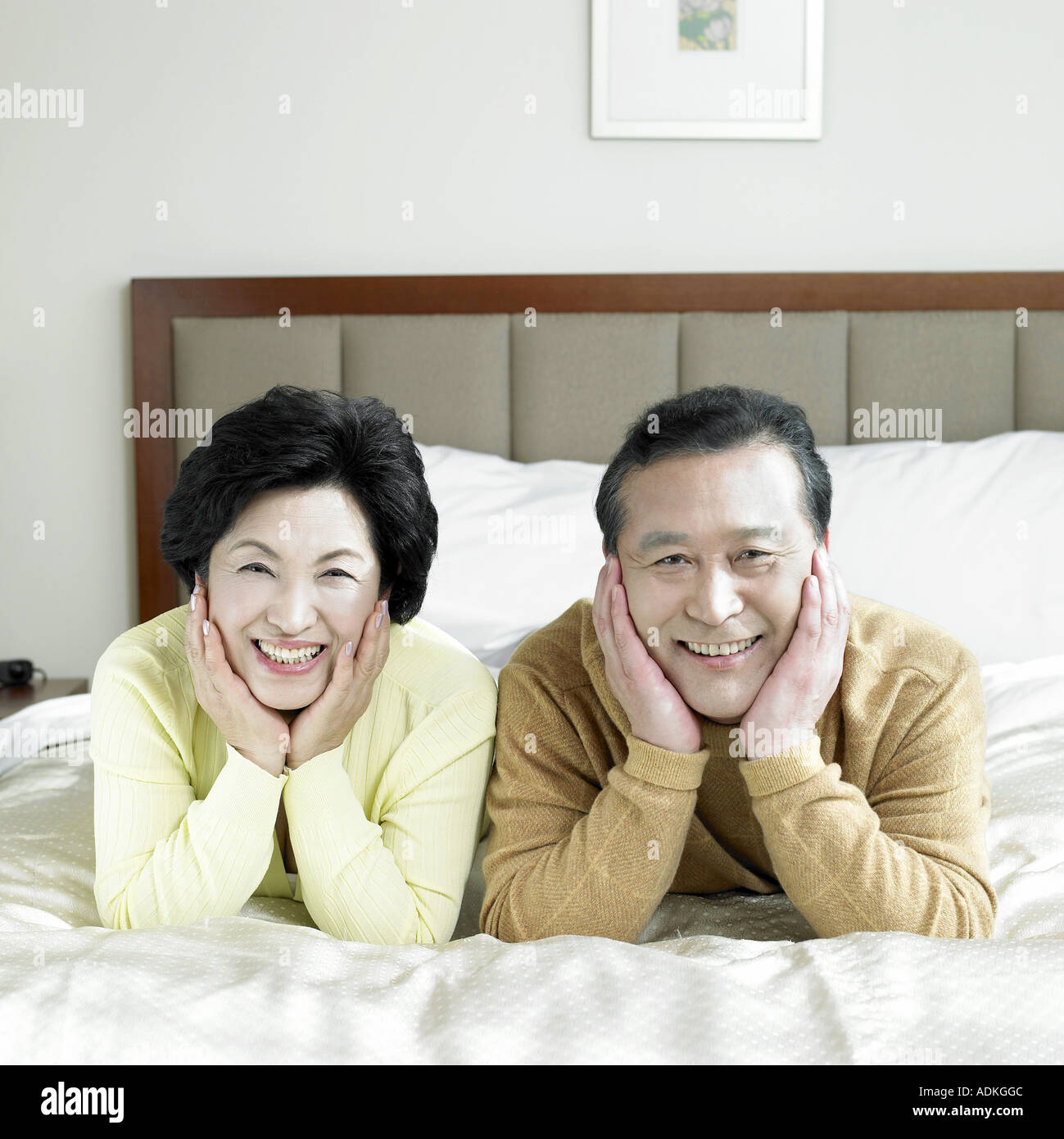 an old couple on a bed Stock Photo - Alamy