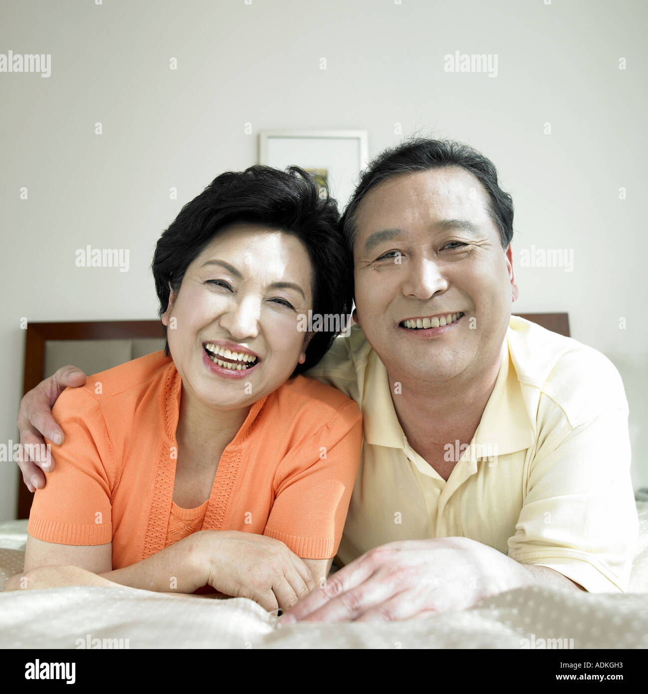 an old couple on a bed Stock Photo - Alamy