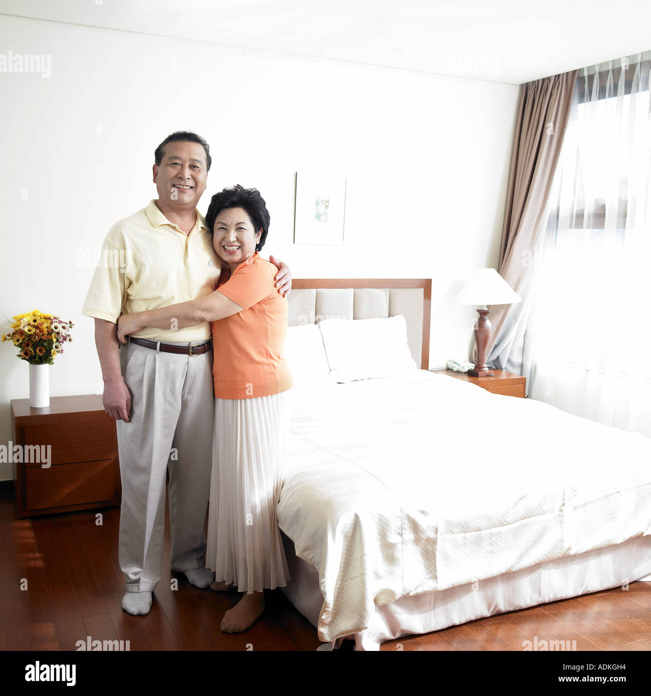 an old couple on a bed Stock Photo - Alamy