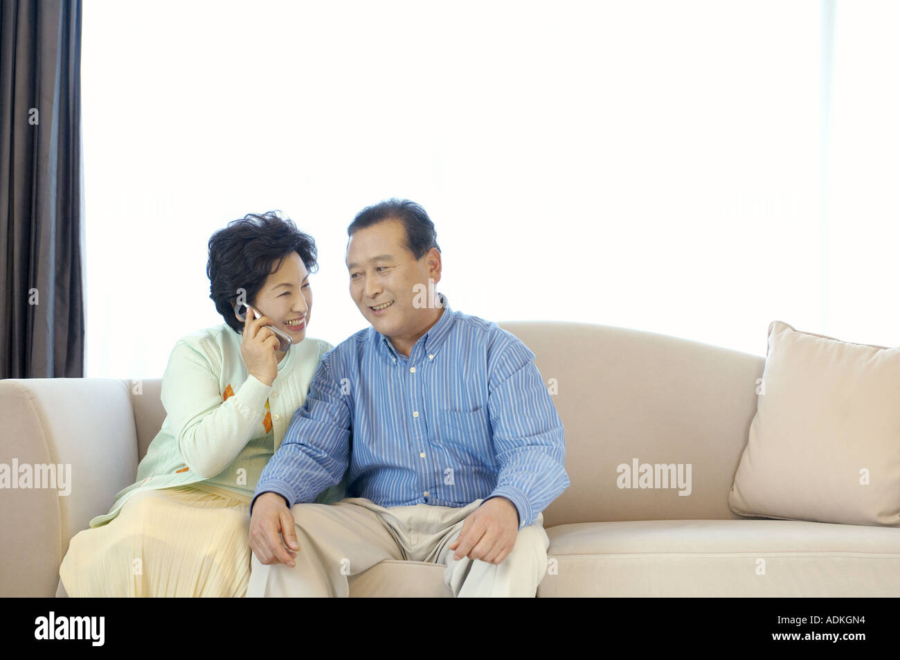 a calling wife and her husband Stock Photo - Alamy
