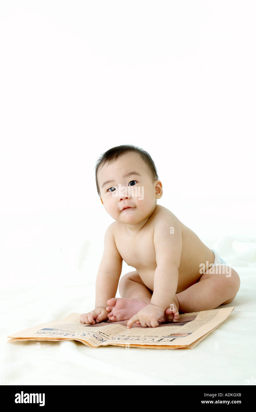 Baby reading newspaper hi-res stock photography and images - Alamy