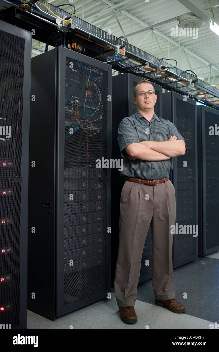 Portrait of a technician standing in a server room Stock Photo - Alamy