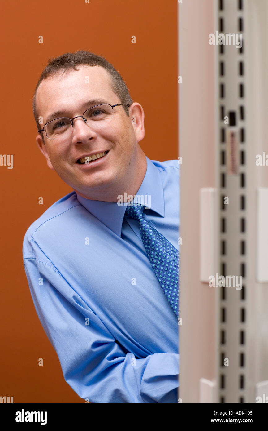 Portrait of a businessman behind wall hi-res stock photography and ...