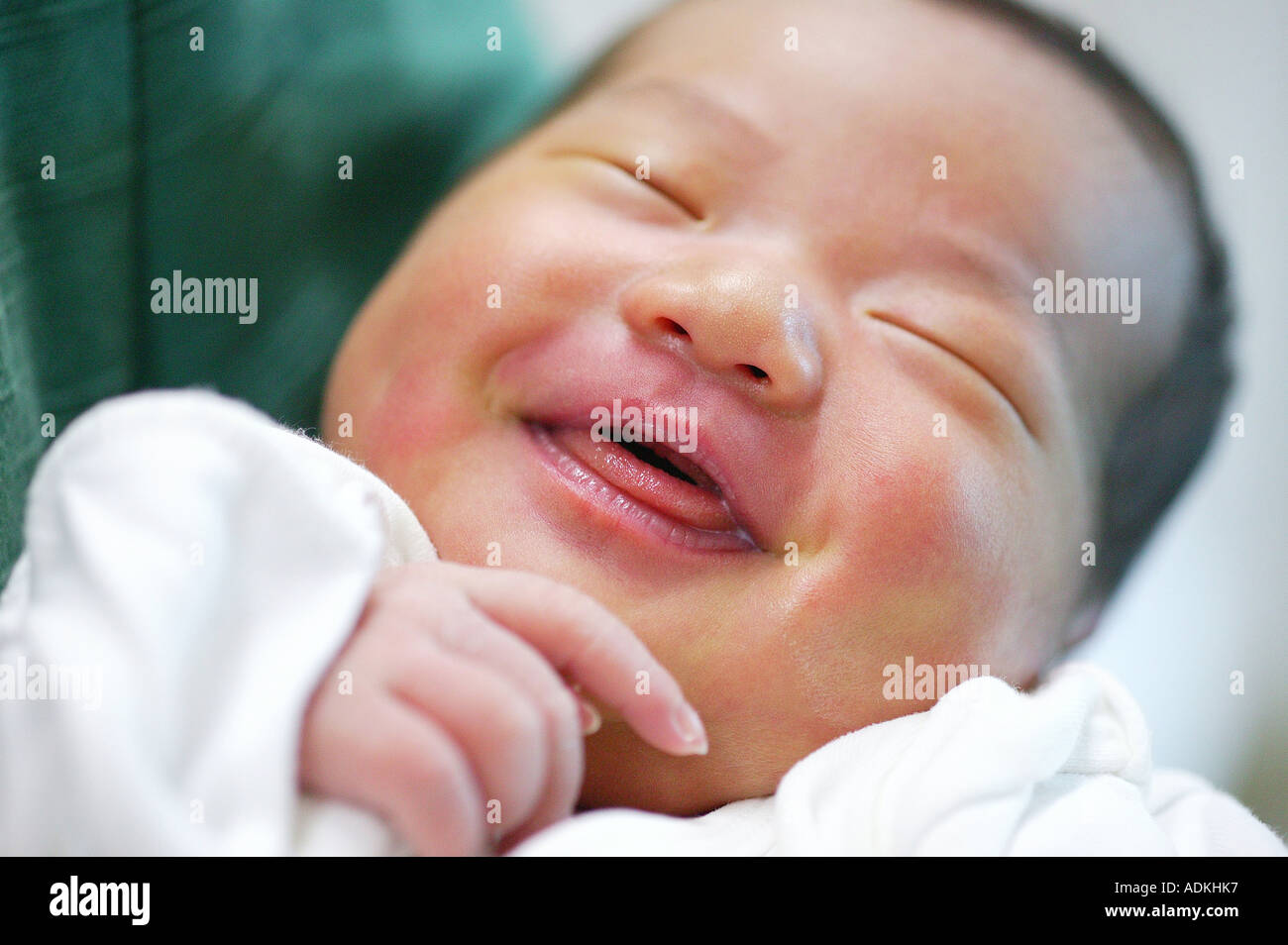 Newborn baby smiling close up hi-res stock photography and images - Alamy