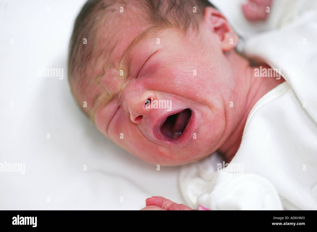 a crying newborn baby Stock Photo - Alamy