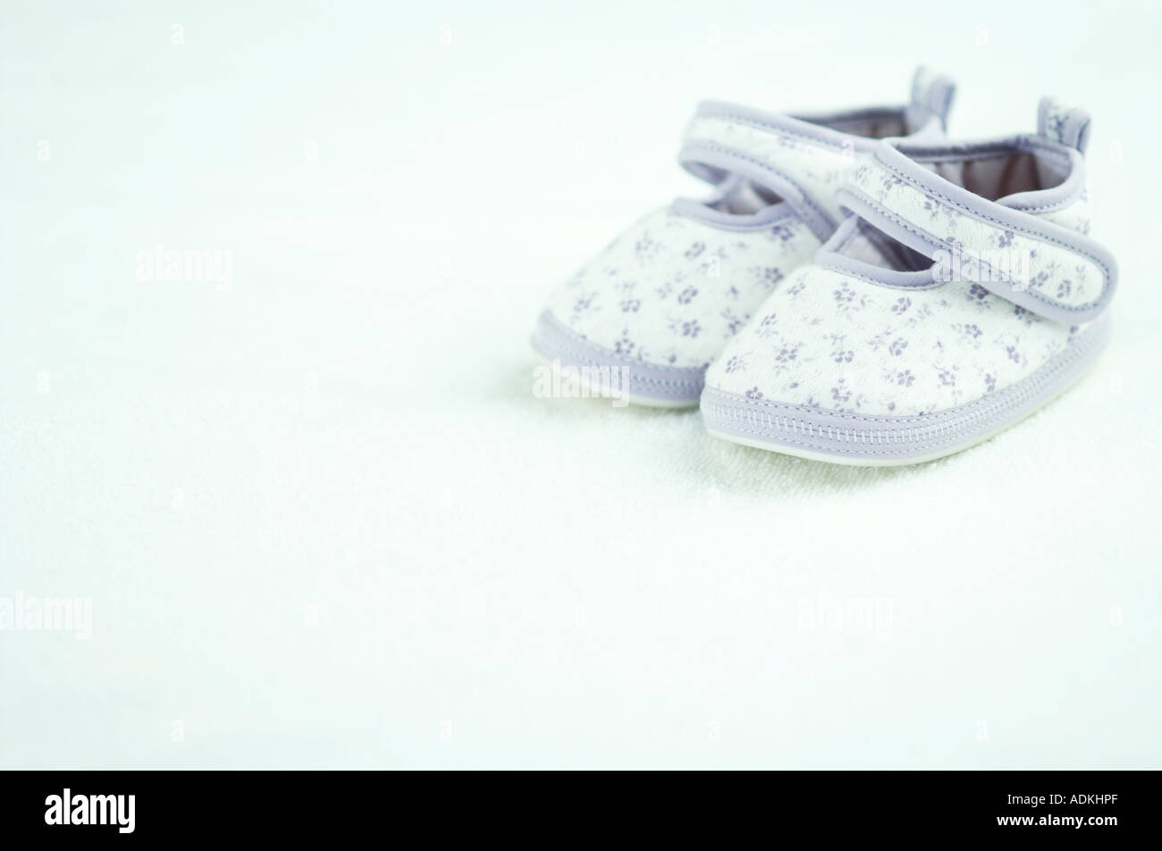 a baby shoe on the empty back ground Stock Photo - Alamy