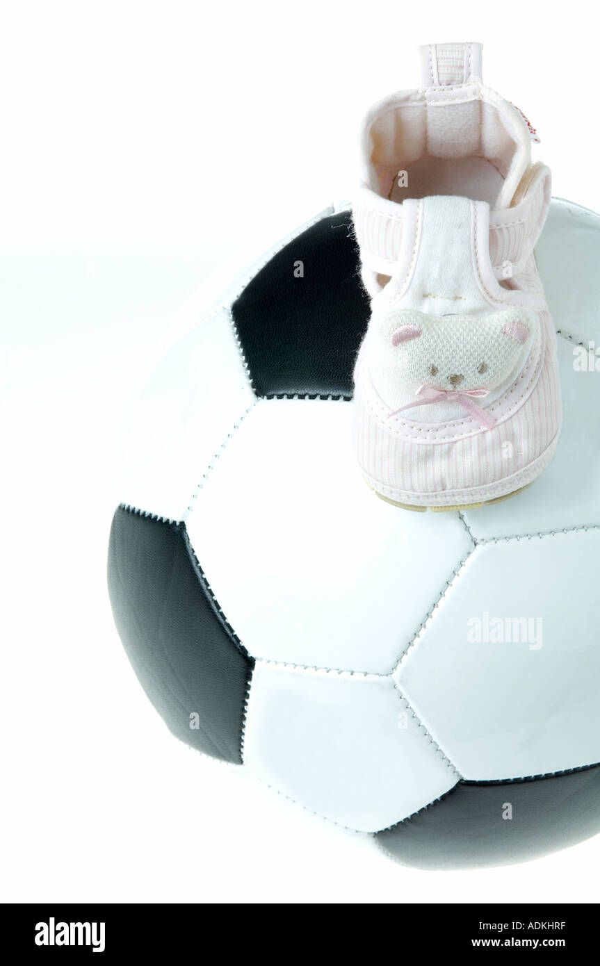 a baby shoe on the soccer ball Stock Photo - Alamy