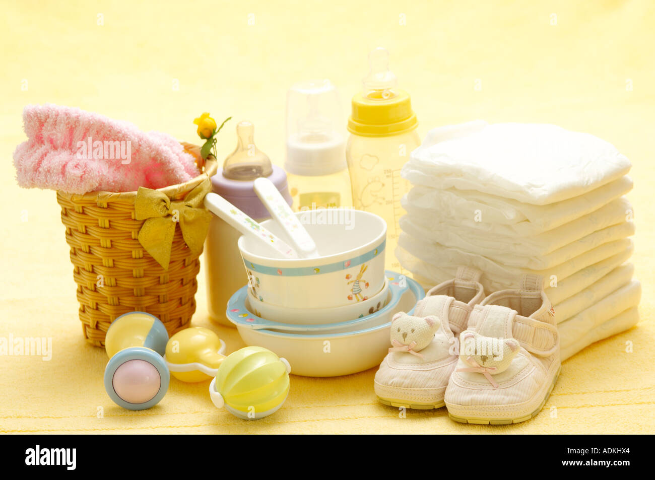 the total baby supplies on the yellow backgroud Stock Photo - Alamy