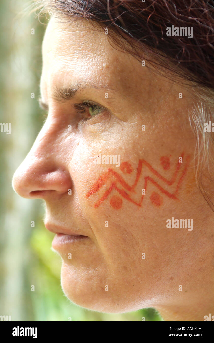 Face painted with Annatto (achote) plant paint. The drawing symbolizes ...