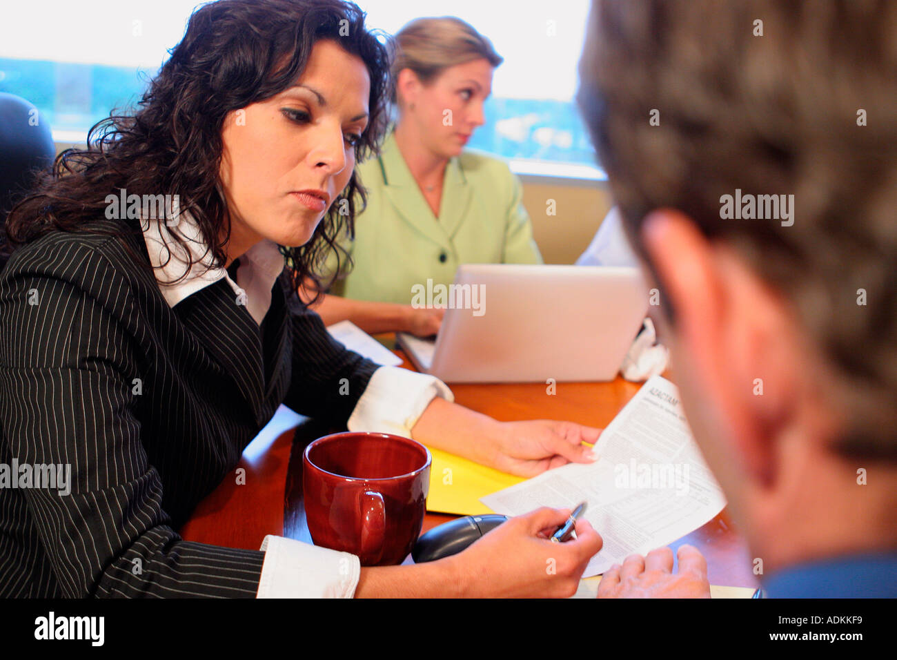Group of business executives sitting in a conference room Stock Photo ...