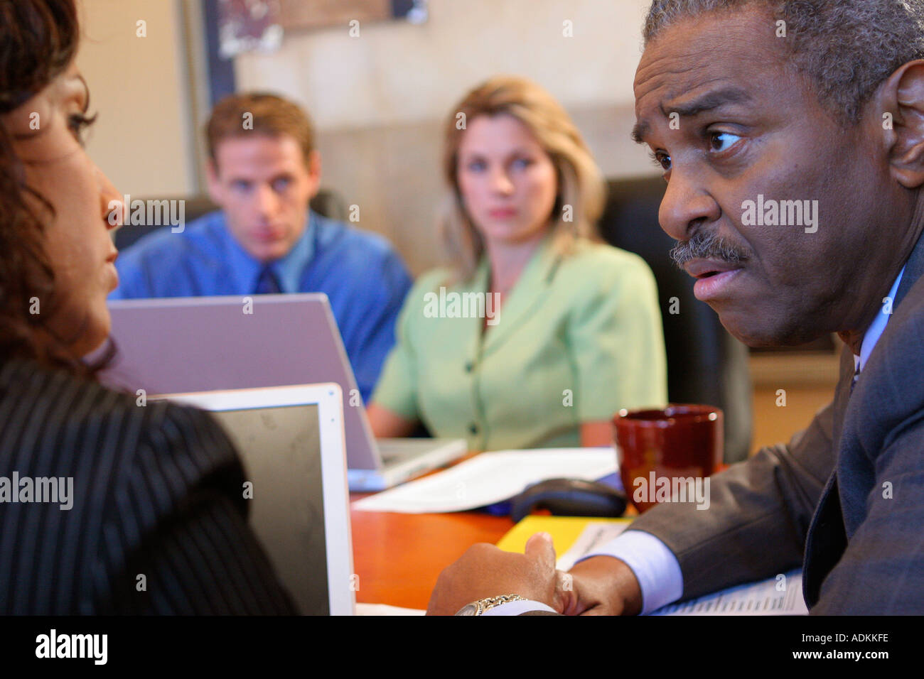 Group of business executives sitting in a conference room Stock Photo ...