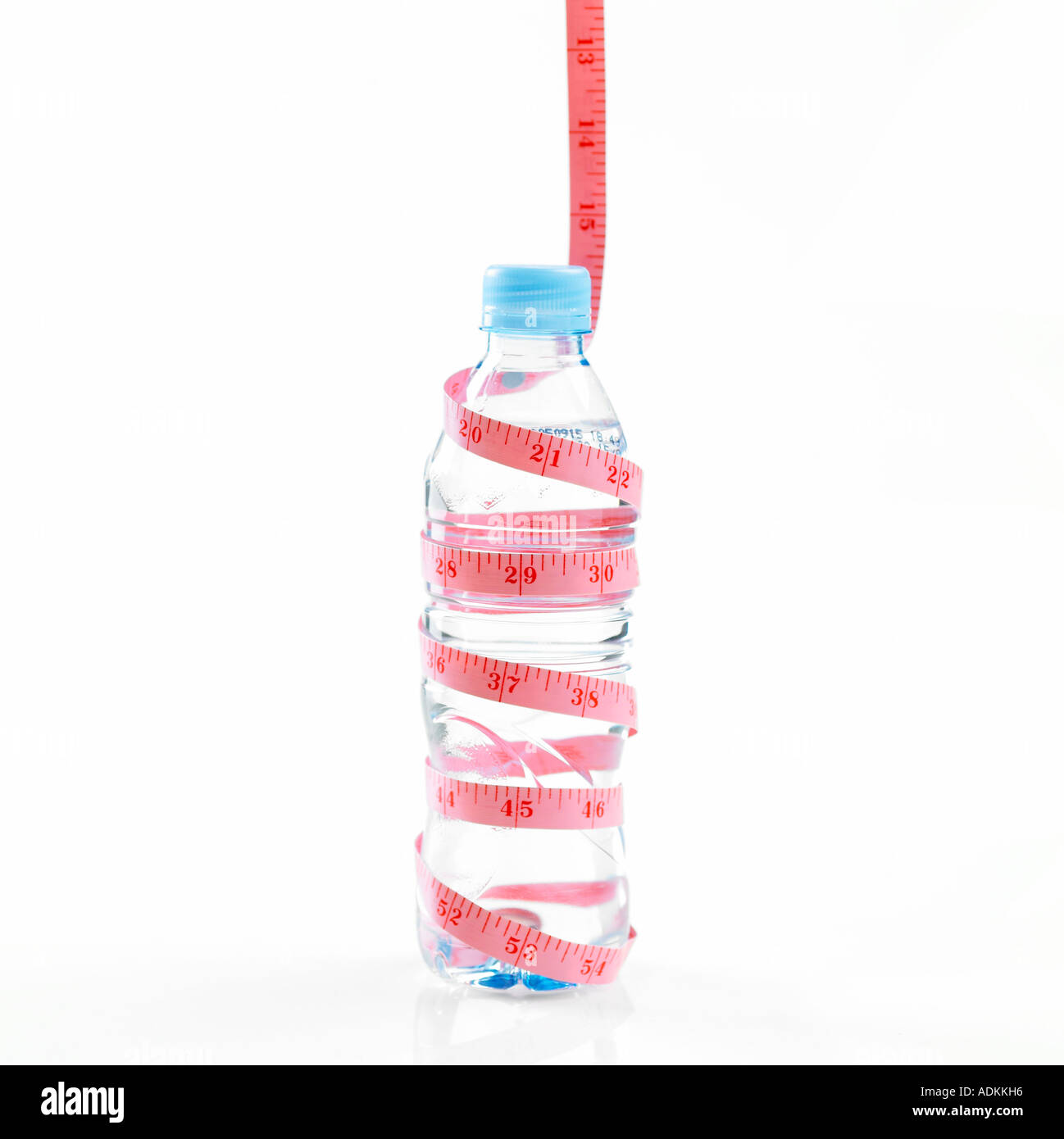 a water bottle and a ruler Stock Photo - Alamy
