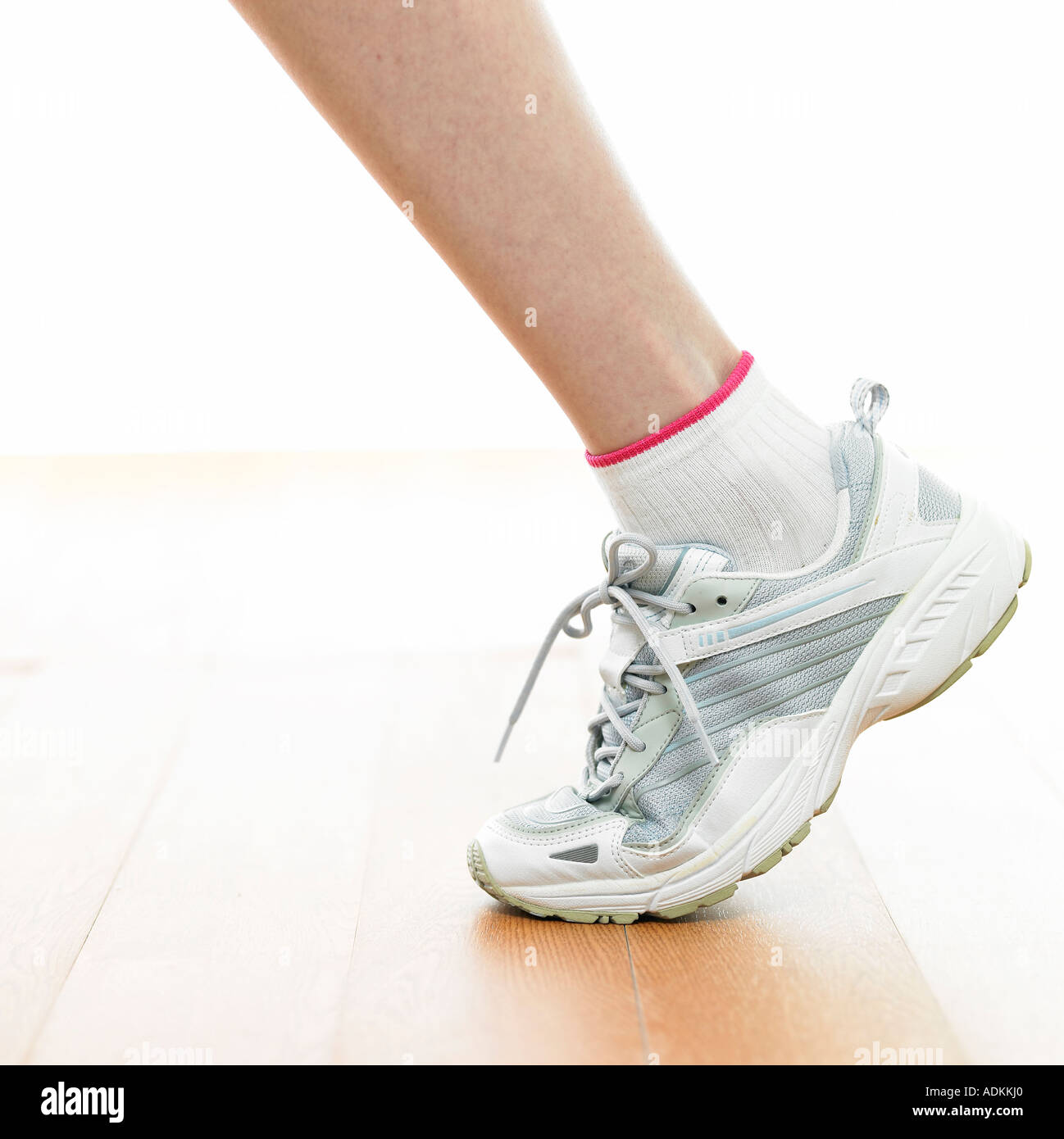 a woman s feet wearing running shoes Stock Photo - Alamy