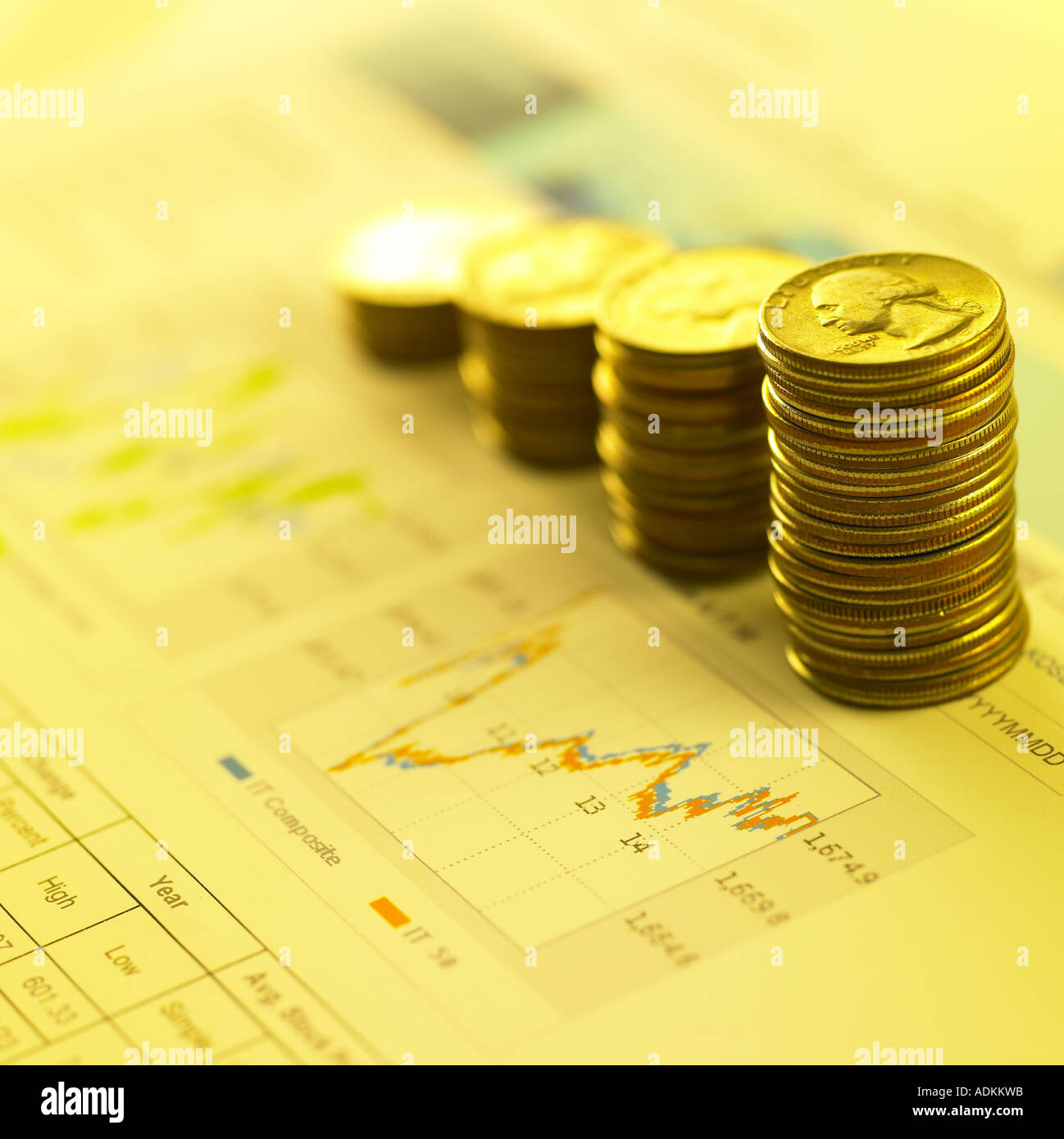 finance a graph and coin towers Stock Photo - Alamy
