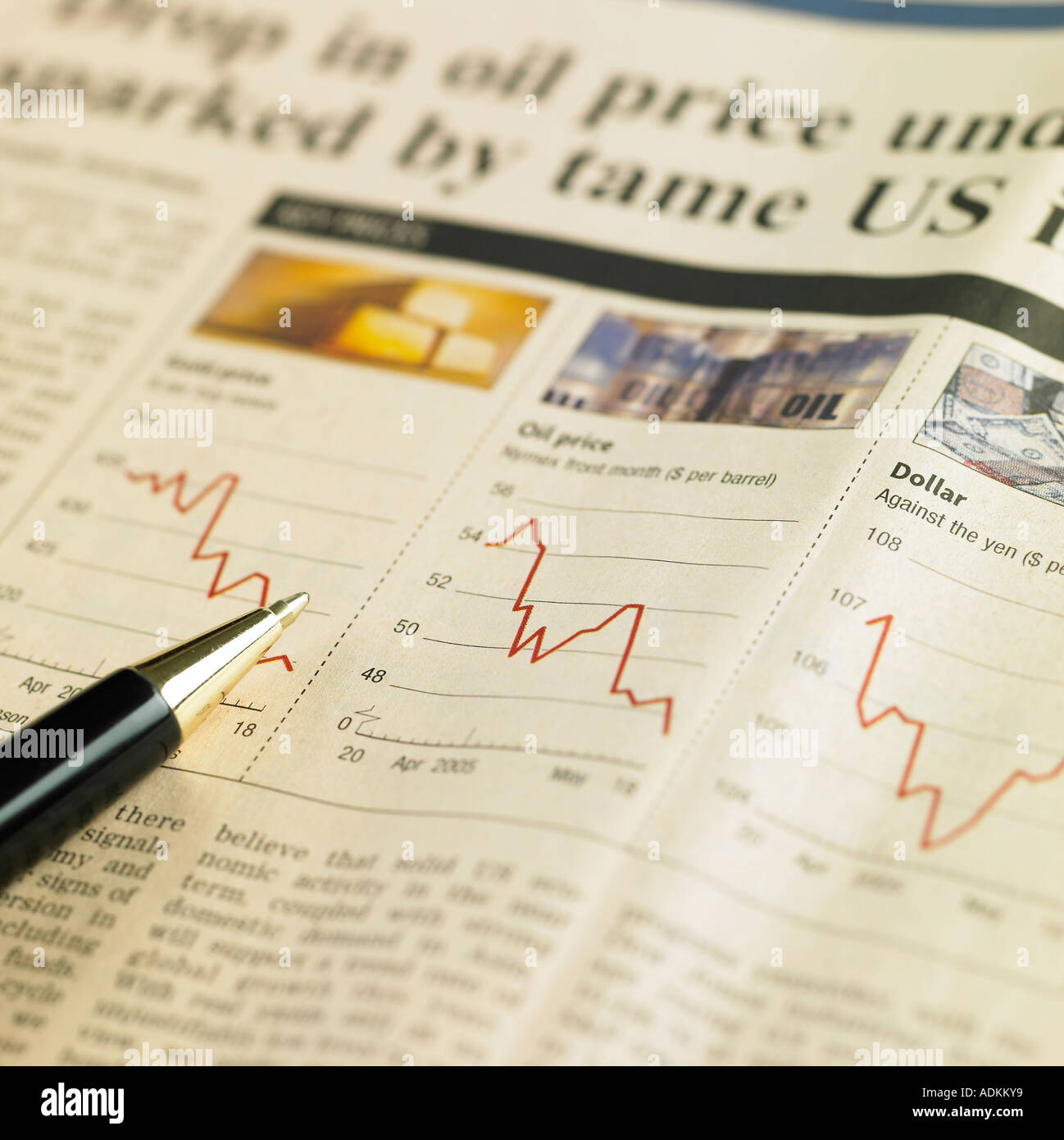business article a graph and a pen on a newspaper Stock Photo - Alamy