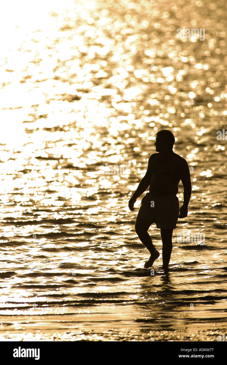 Man on beach Stock Photo - Alamy
