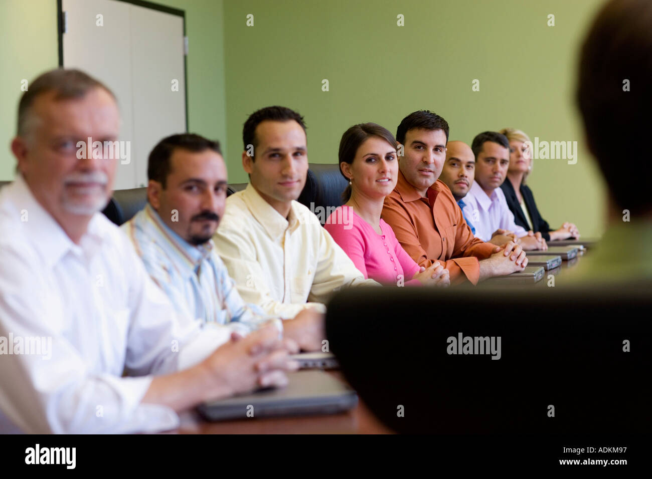 Executives sitting around conference table hi-res stock photography and ...